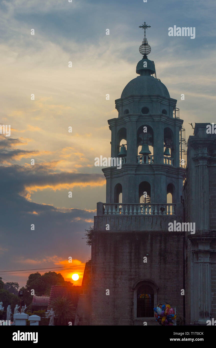 A sunset sky behind a church tower Stock Photo - Alamy