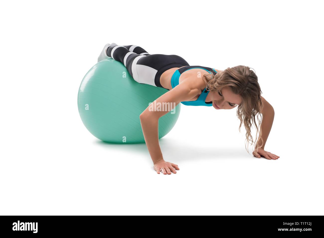 Blonde doing fitness on fitball isolated shot Stock Photo - Alamy