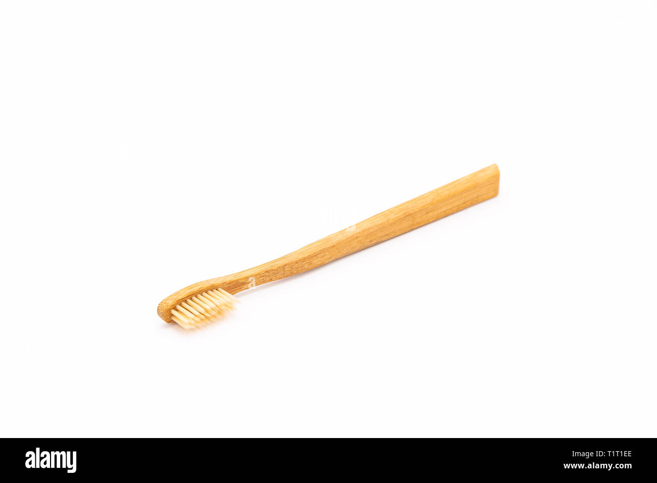 Close up bamboo toothbrush on white background Stock Photo - Alamy