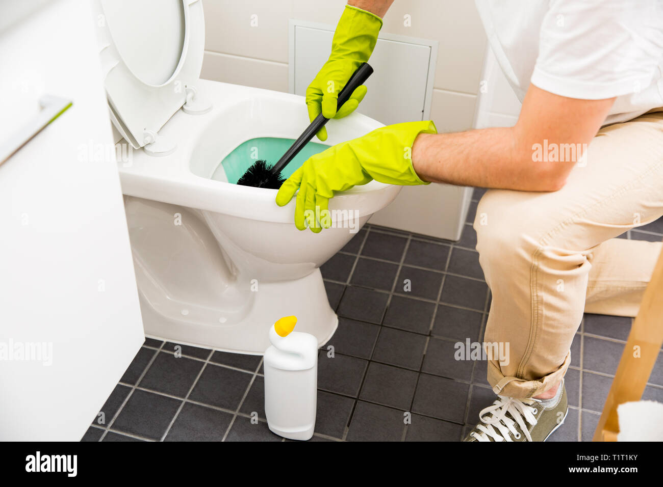 Person cleaning the toilet hi-res stock photography and images - Alamy