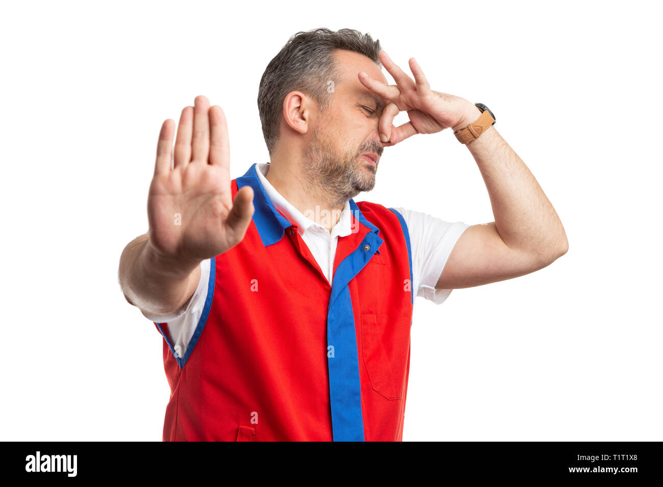 Disgusted supermarket or hypermarket male employee making gross smell ...