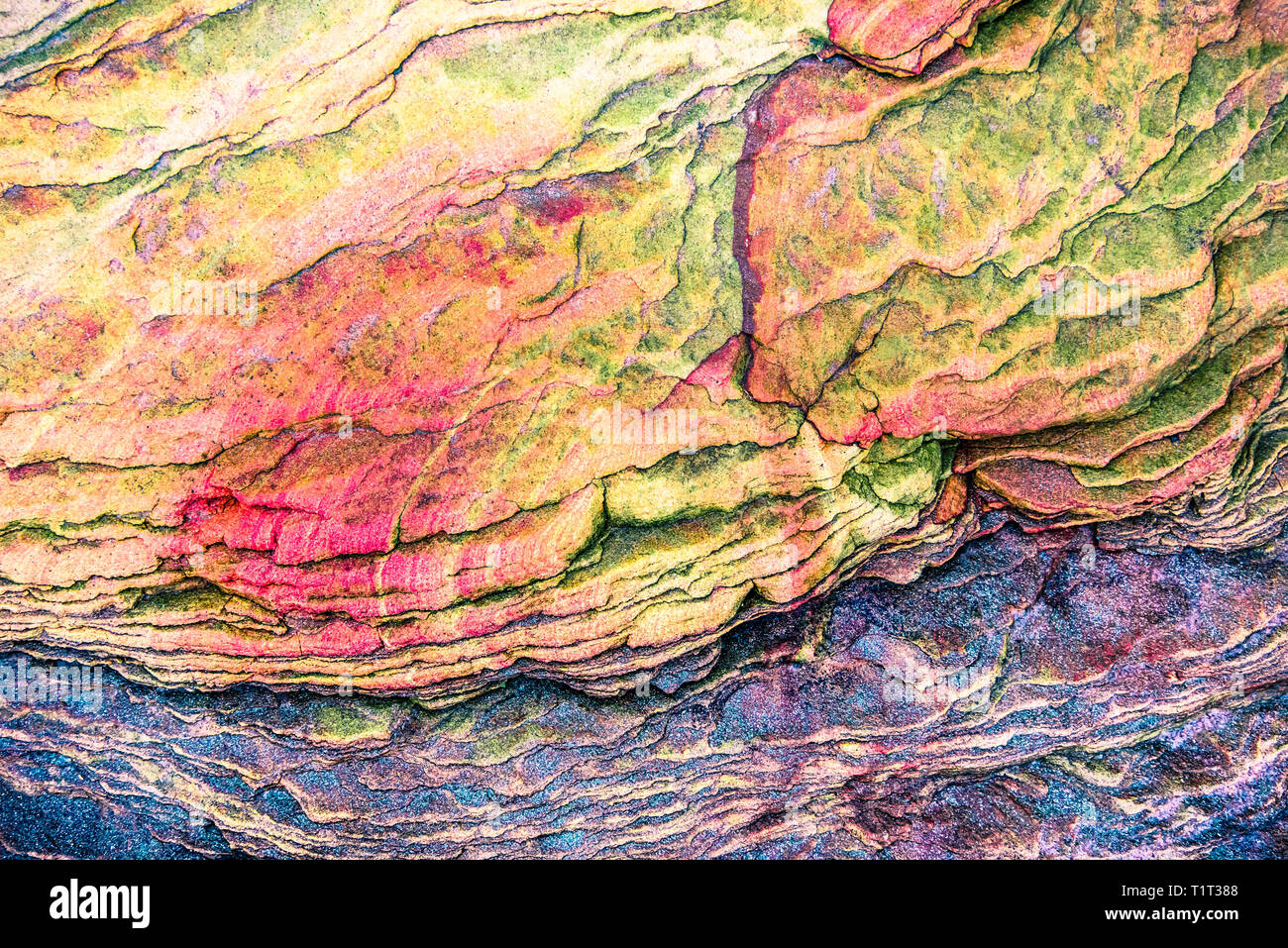 Purple, red, orange, green sediments and minerals, rock formations - a ...