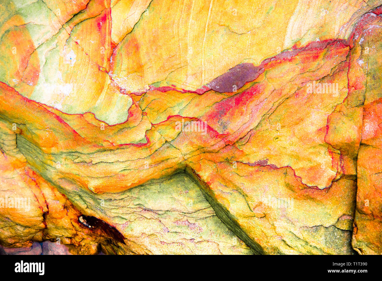 Orange, yellow, green, red sediments and minerals, rock formations - a ...