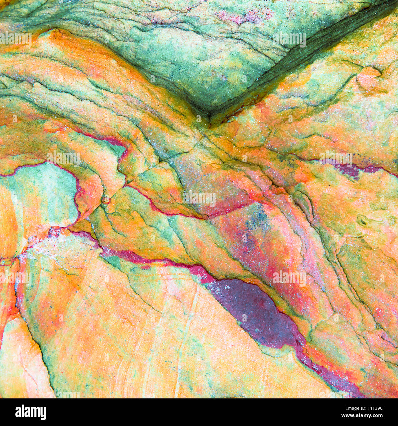 Orange, yellow, green, red sediments and minerals, rock formations - a ...
