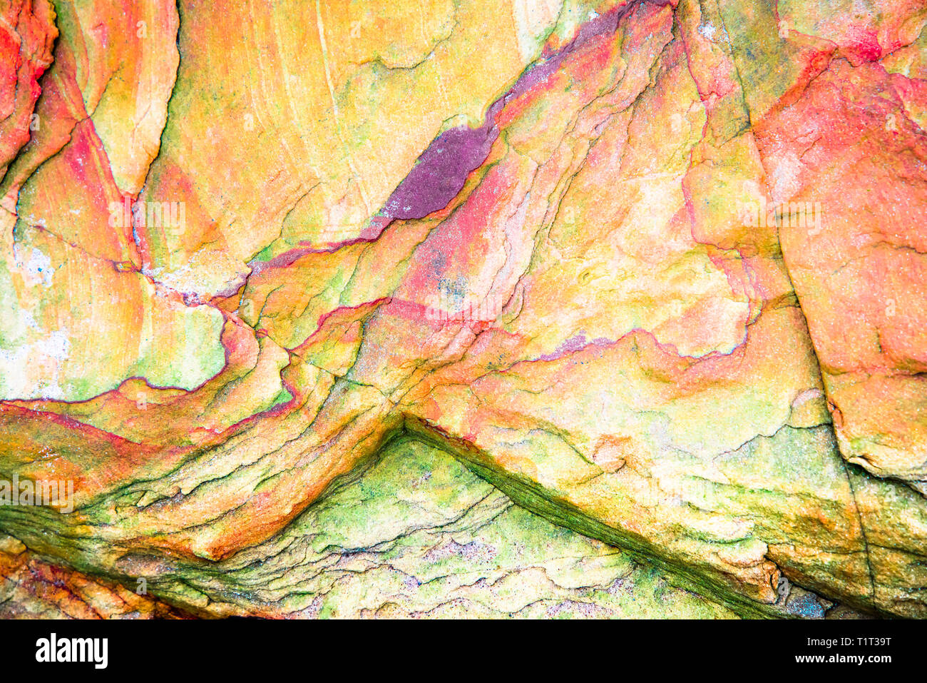 Orange, yellow, green, red sediments and minerals, rock formations - a ...
