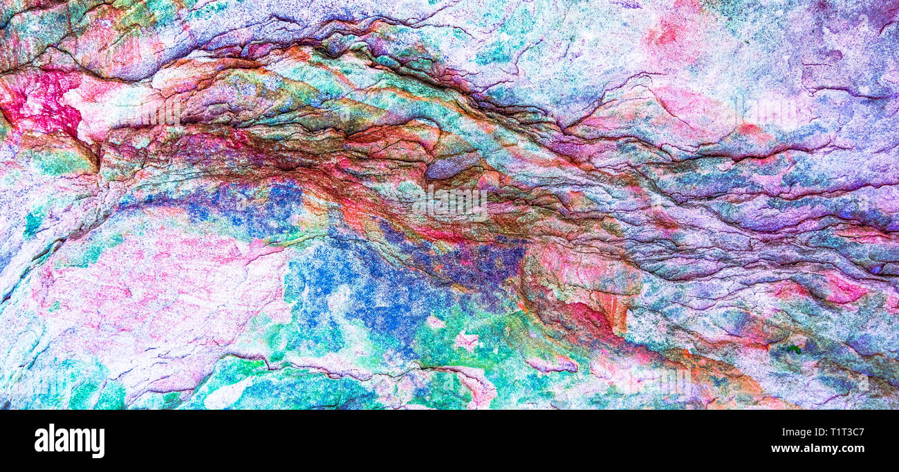 Orange, green, blue sediments and minerals, rock formations - a ...