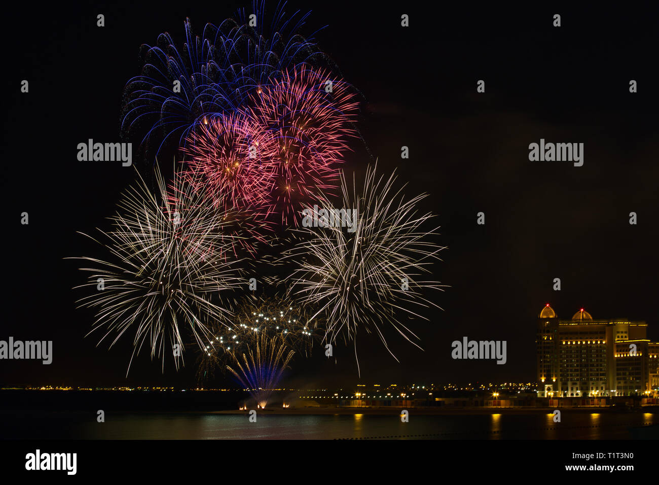Firework show with a hotel building in the background Stock Photo - Alamy