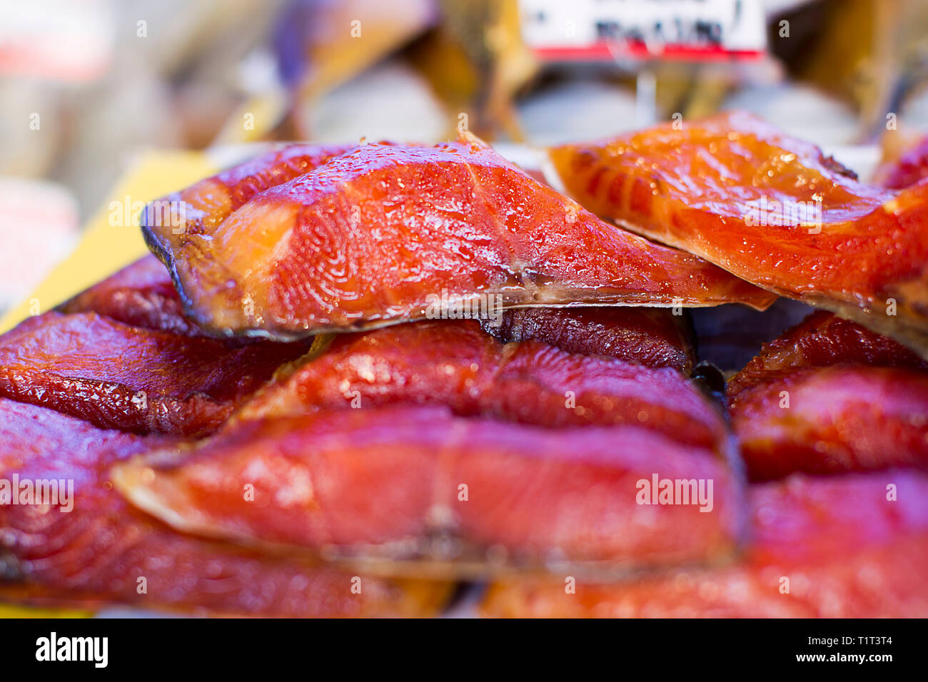 Chunks of red smoked fish.Dried fish at the fish market Stock Photo - Alamy