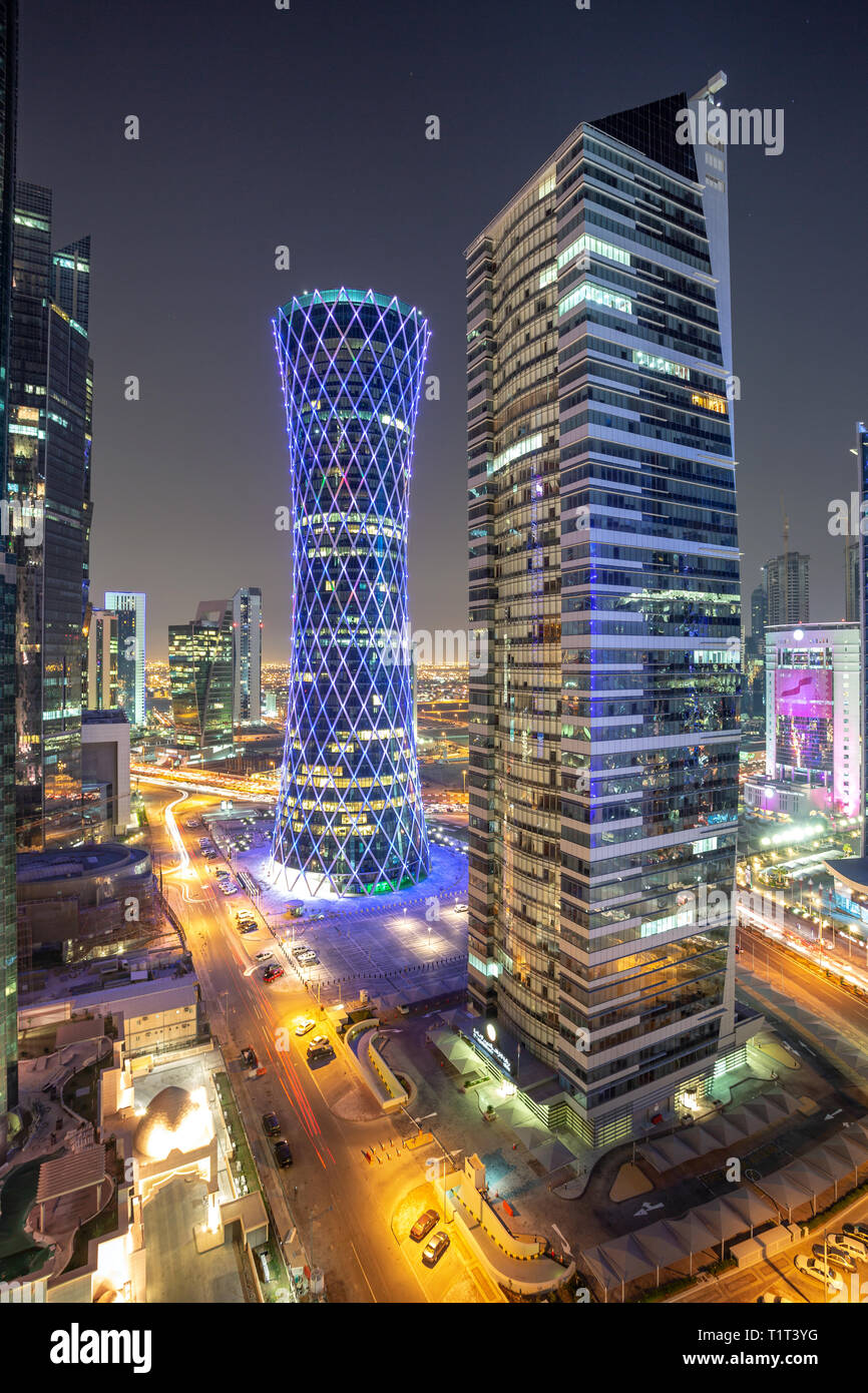 Night lights in high rise towers with blue sky background hi-res stock ...