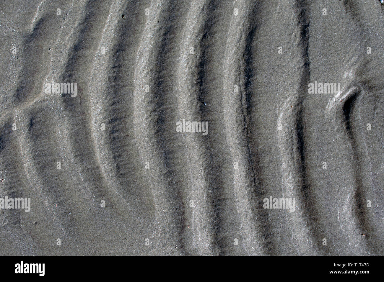 Wavy beach sand background, vertical waves, close up Stock Photo - Alamy