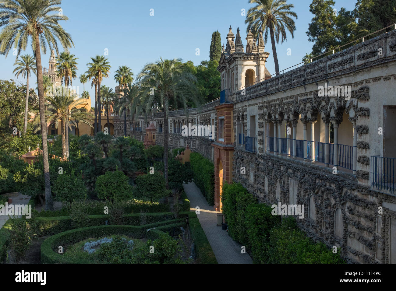 Looking alongside the ornate internal wall of the gardens inside the ...