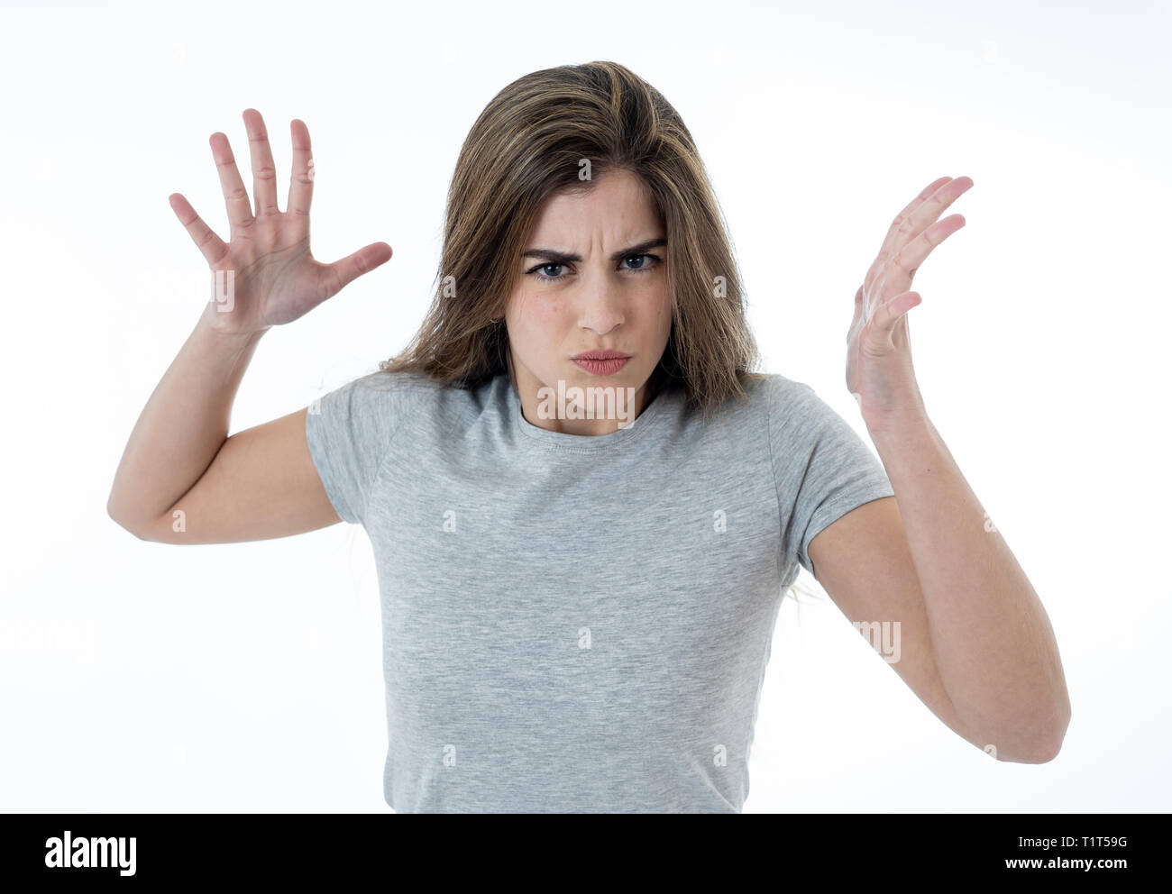 Close up of young attractive caucasian woman with an angry face ...