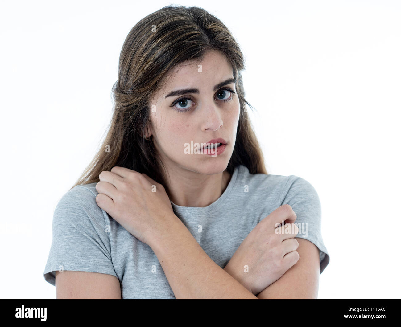 Portrait of young sad woman, scared and concerned, looking worried and ...