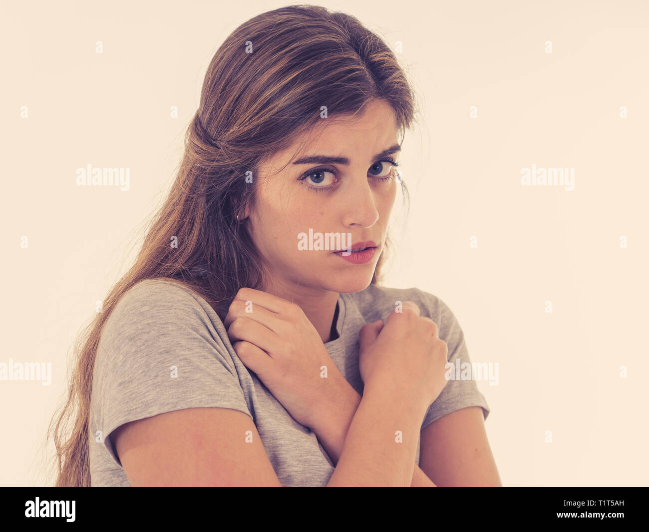 Portrait of young sad woman, scared and concerned, looking worried with ...