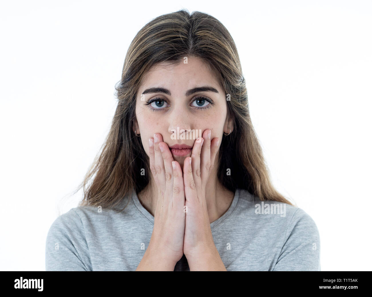 Young sad woman, serious and concerned, looking shocked and worried ...