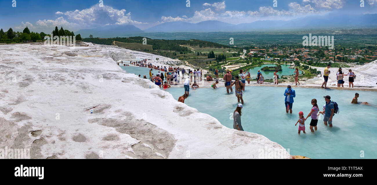 Tourists bathing in the travatine pools oand thermal waters of ...