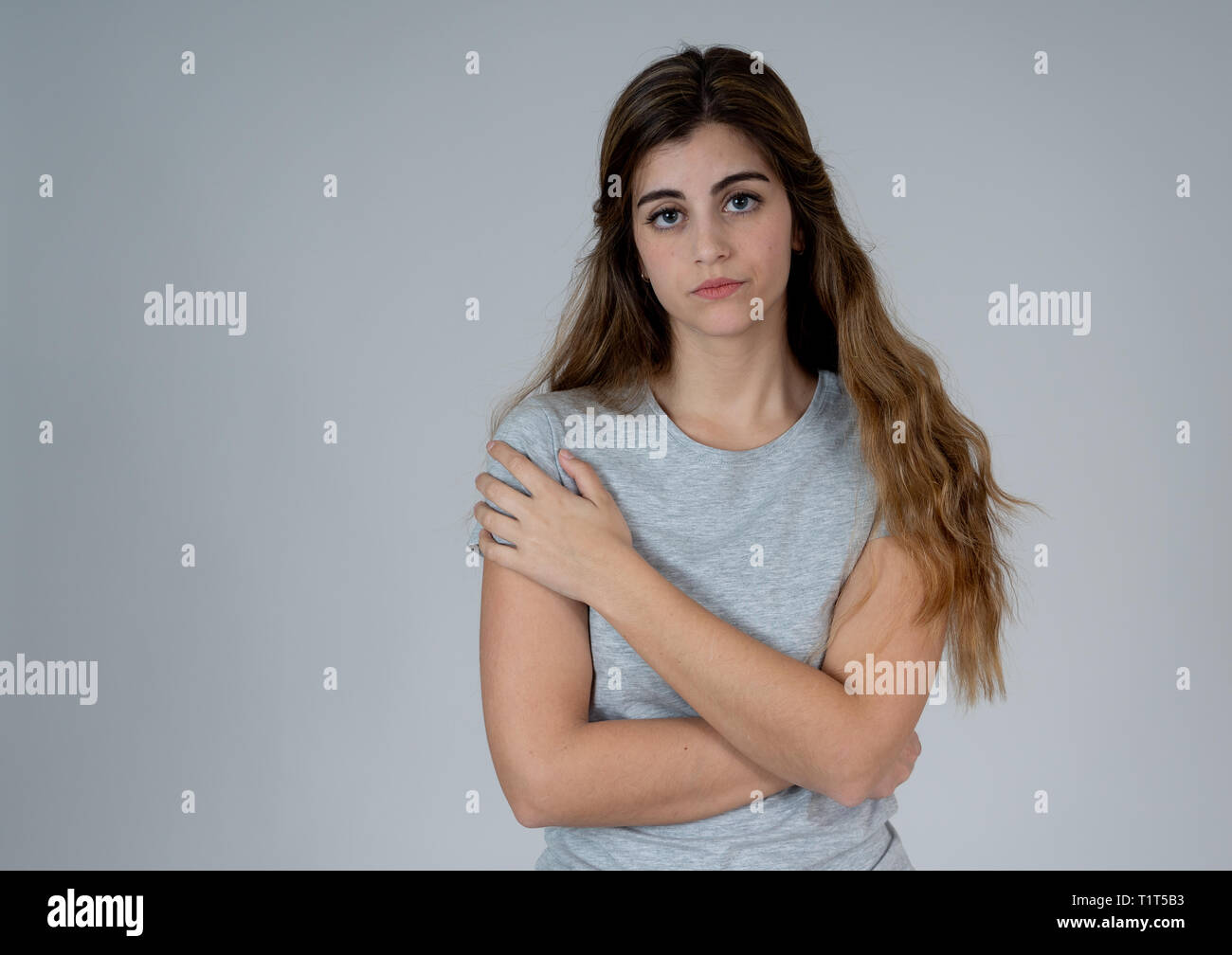 Portrait of young sad woman, serious and concerned crying and feeling ...