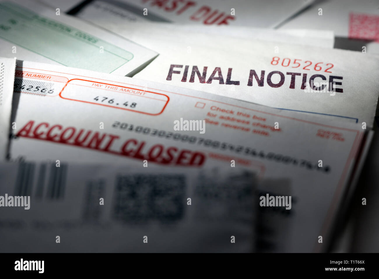 still life of overdue bills with "final Notice", "past due" and ...