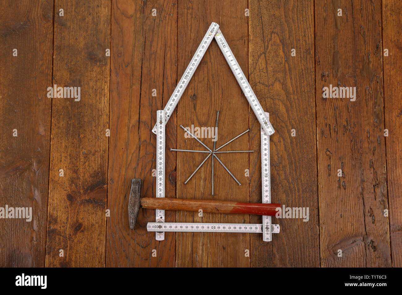 Compositions with a wooden construction meter Stock Photo - Alamy