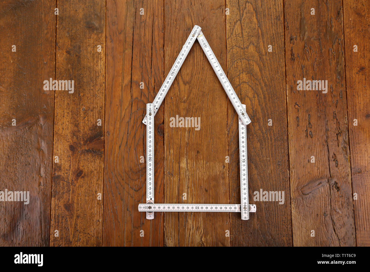 Compositions with a wooden construction meter Stock Photo - Alamy