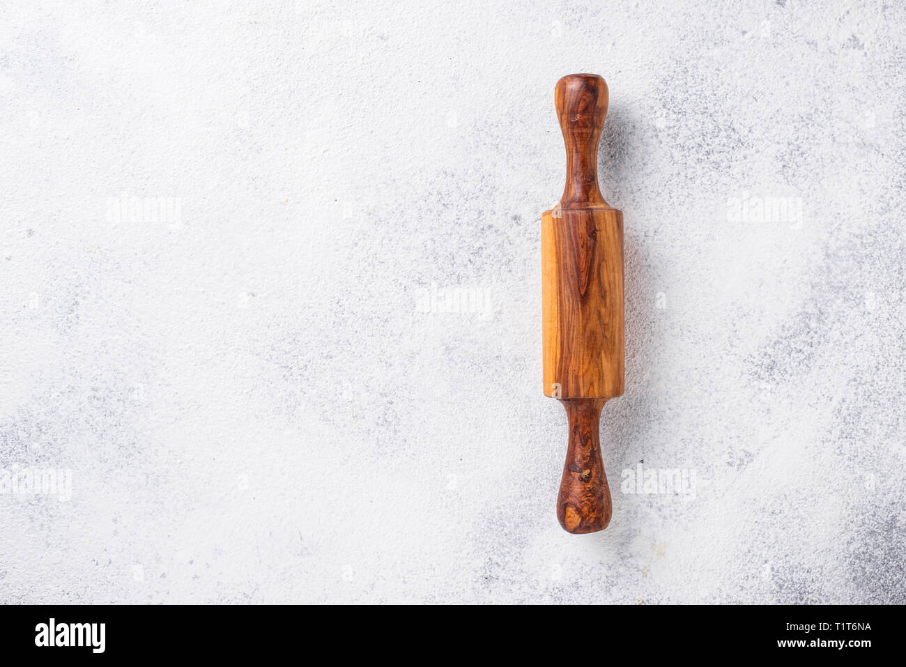 Wooden rolling pin on light background Stock Photo - Alamy