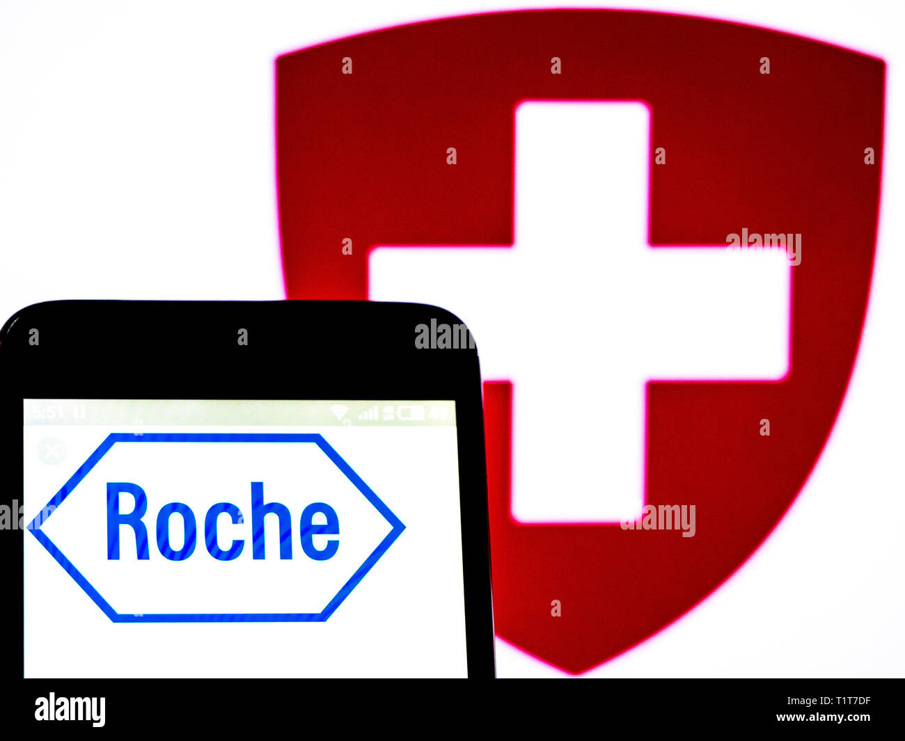 In this photo illustration a Roche Holding AG logo seen displayed on a ...