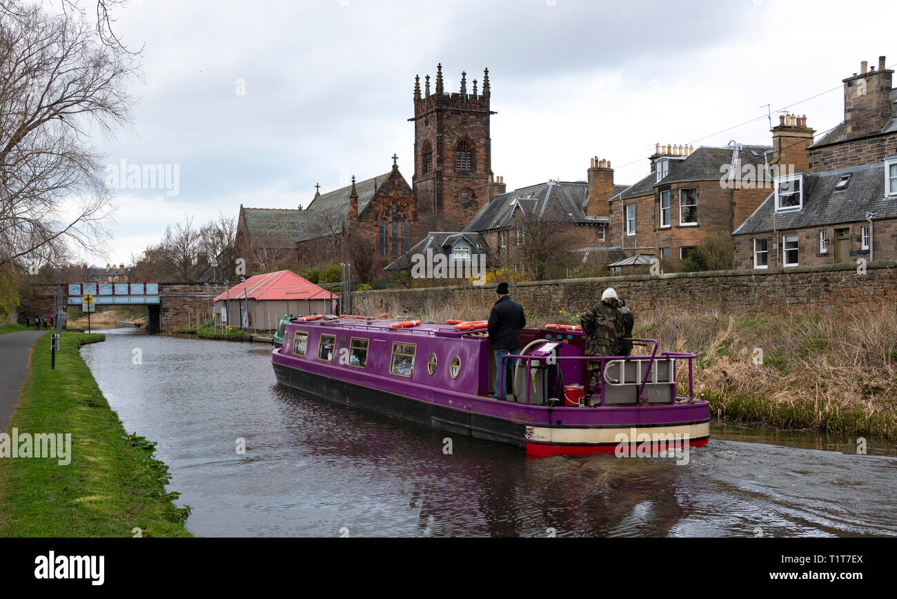 The Union Canal with narrowboat and Polwarth Parish church in early ...