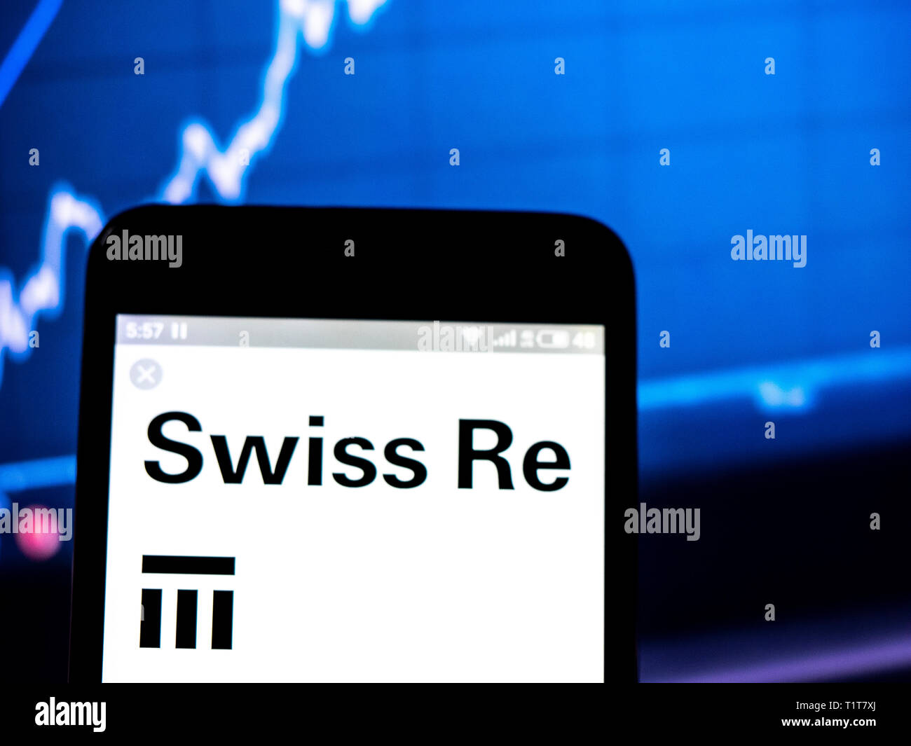 In this photo illustration a Swiss Re logo seen displayed on a smart ...