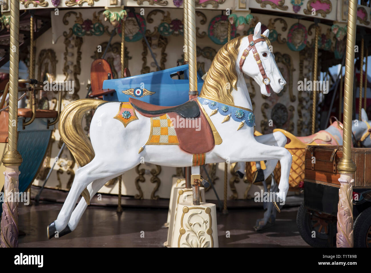 A white wooden horse on a merry-go-round Stock Photo - Alamy