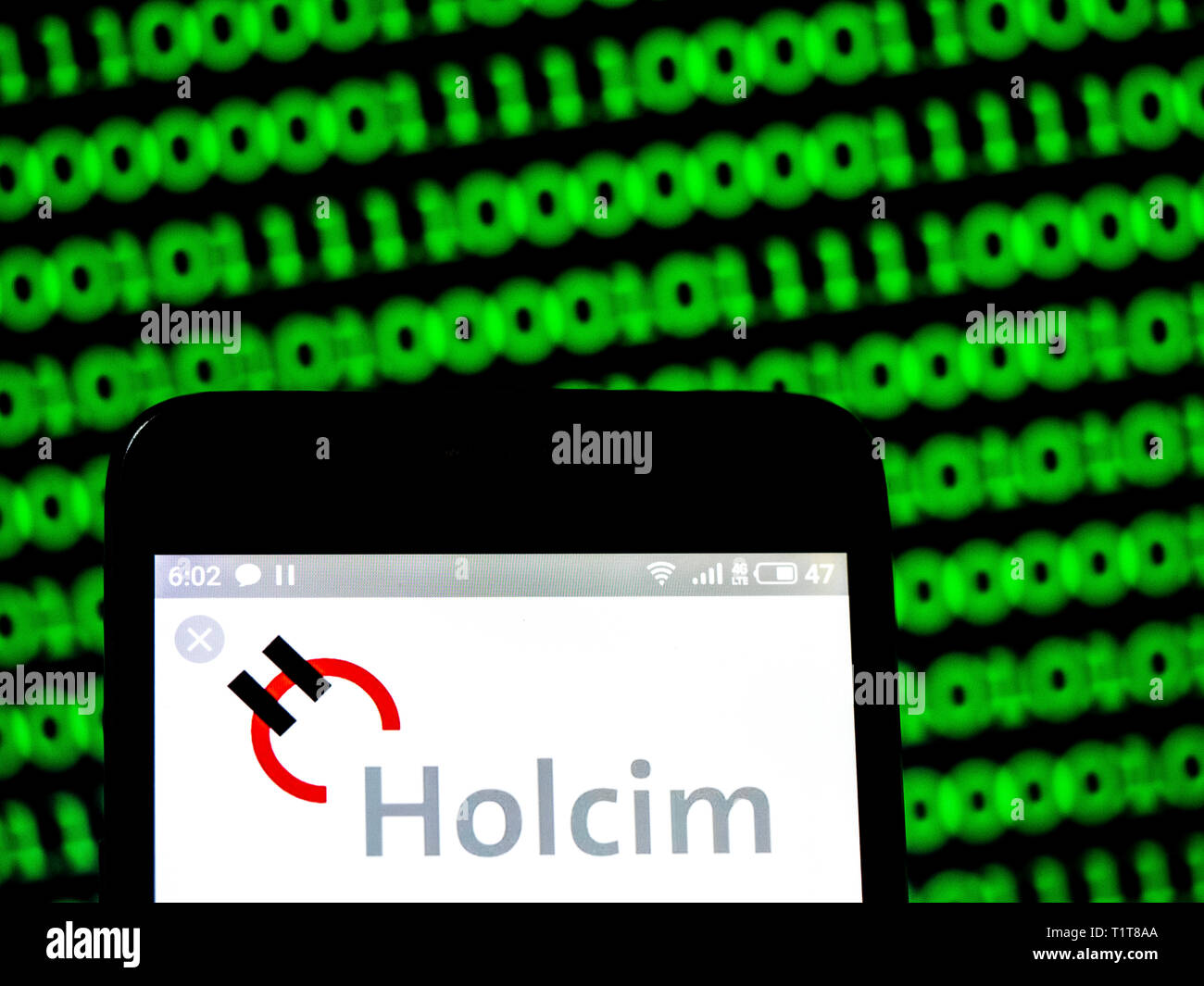 In this photo illustration a Holcim Ltd. logo seen displayed on a smart ...