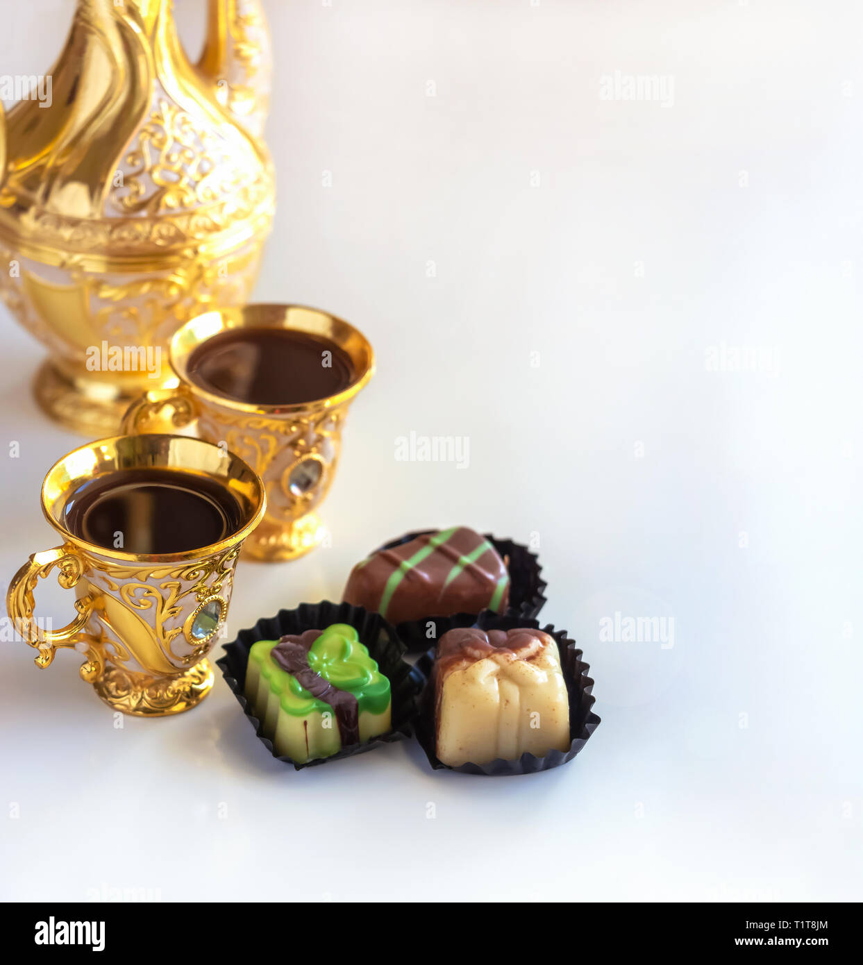 Still life with traditional golden arabic coffee set with dallah, cup ...