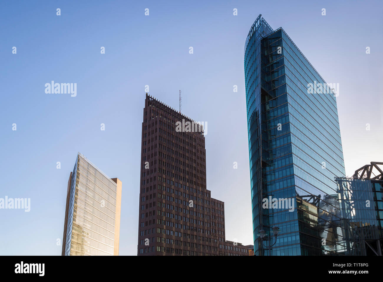 Modern high-rise buildings against clear blue sky at Potsdamer Platz in ...