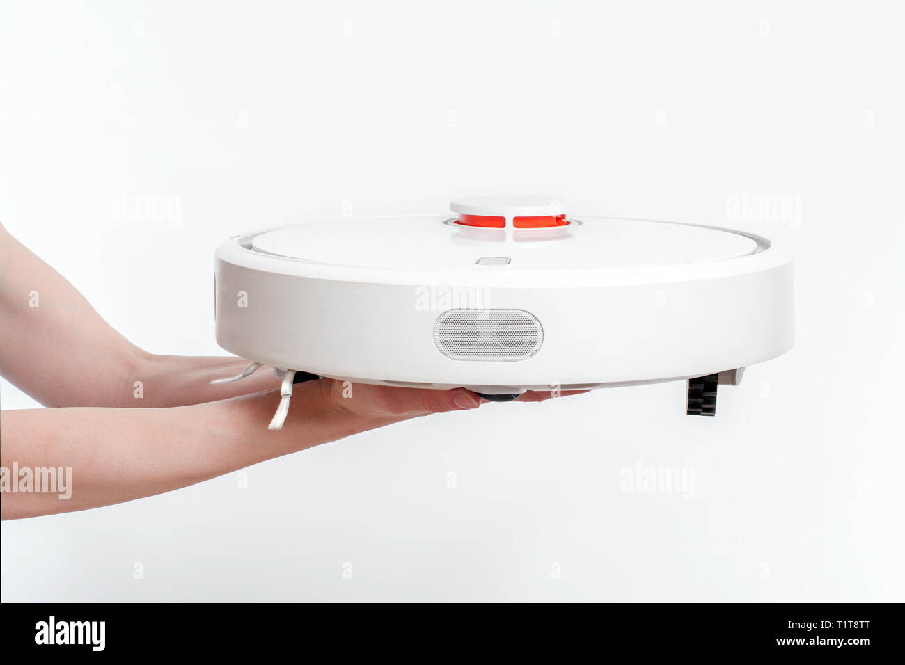 robot vacuum cleaner on hand. concept of gift robotic helper at home ...