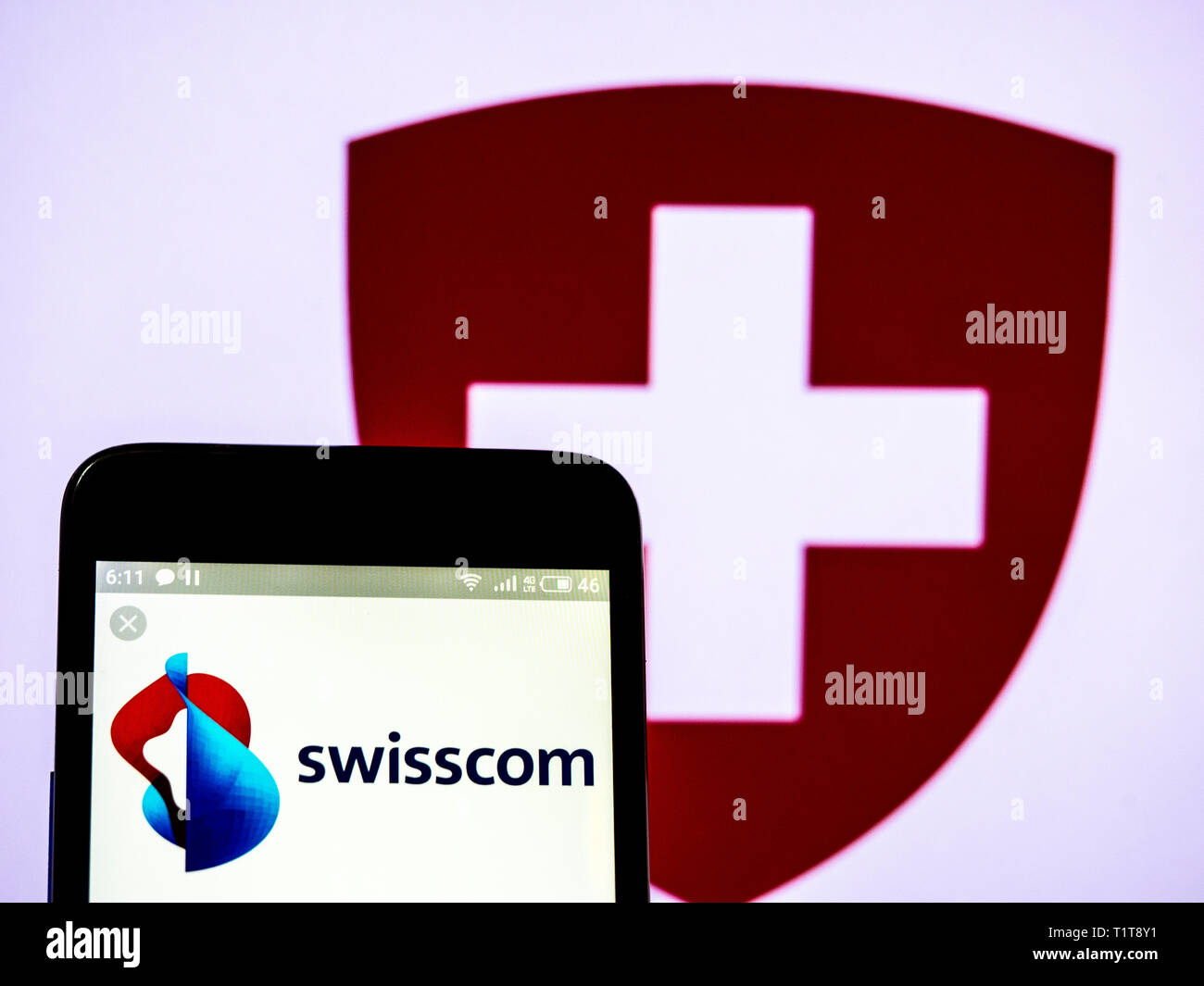 In this photo illustration a Swisscom AG logo seen displayed on a smart ...