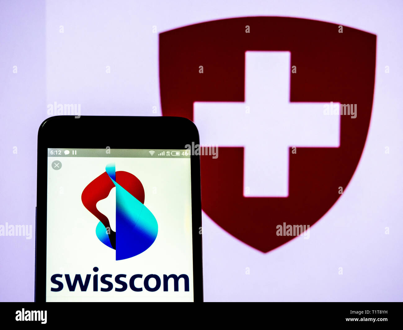 In this photo illustration a Swisscom AG logo seen displayed on a smart ...