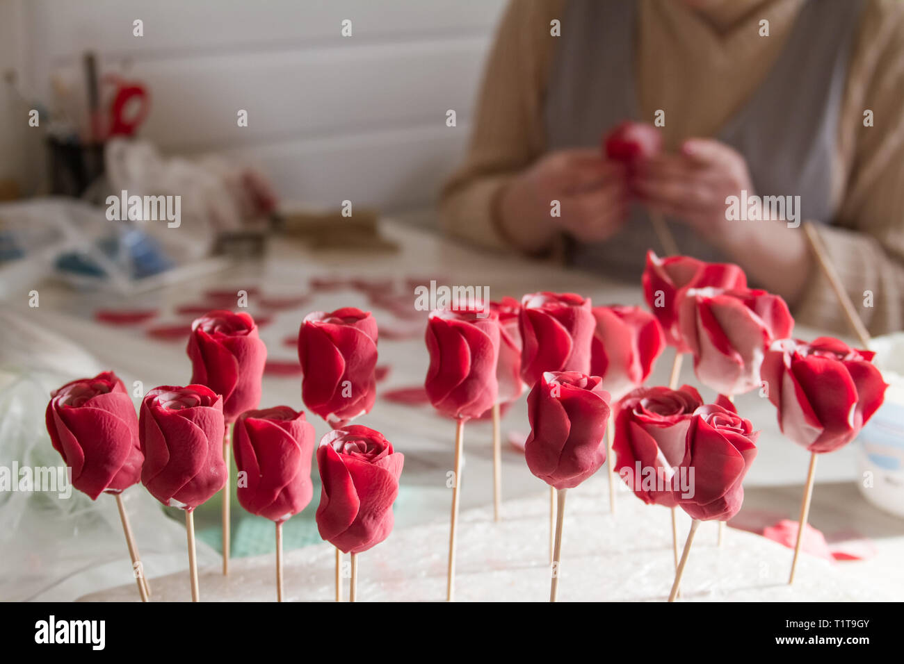 confectionery decoration. Baker makes wedding or birthday marzipan ...