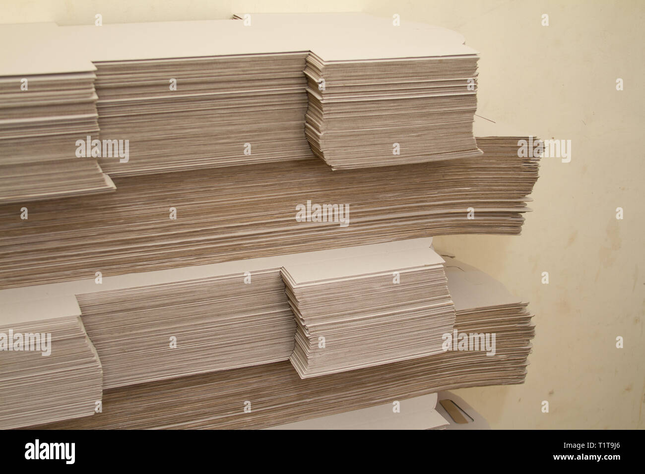 Many large stacks of brown paper against the background of recycled ...