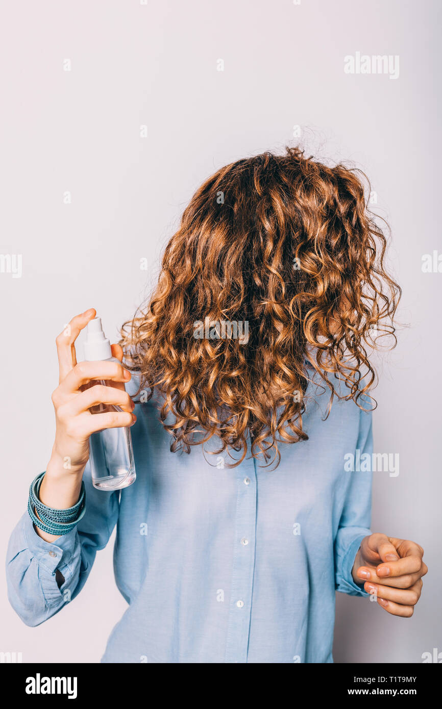 Using hair spray hi-res stock photography and images - Alamy