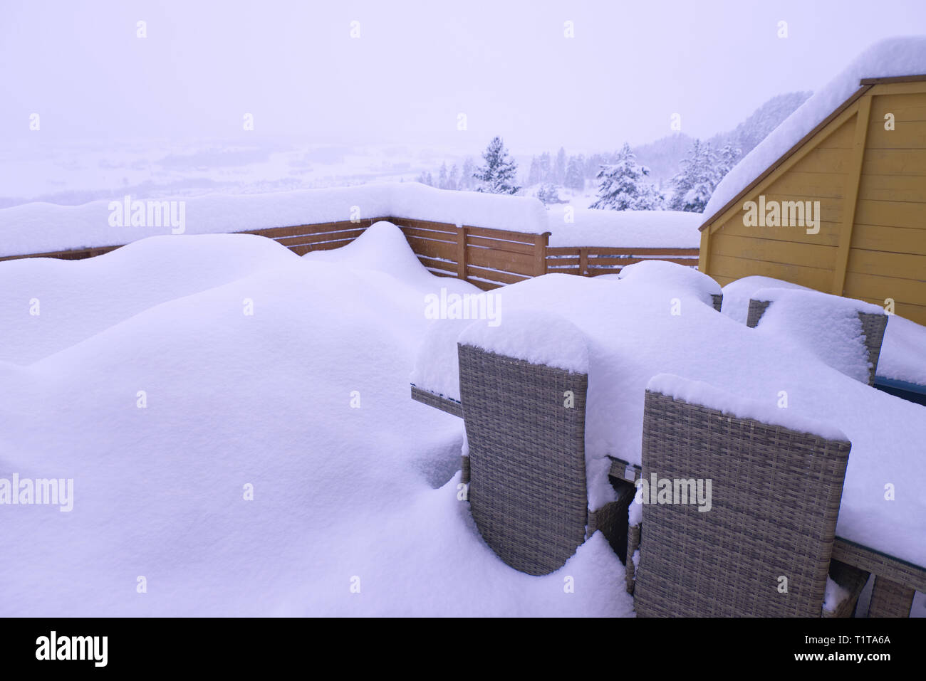 Snow covered deck with furnitures in Norway Stock Photo - Alamy