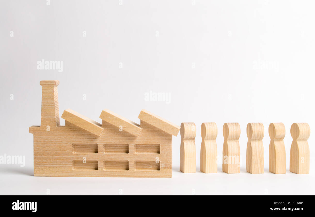 A queue of people line up at the factory. Workers go to work. Hiring ...