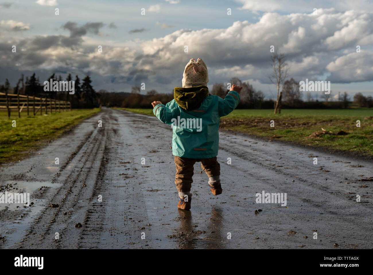 Children playing running rain hi-res stock photography and images - Alamy