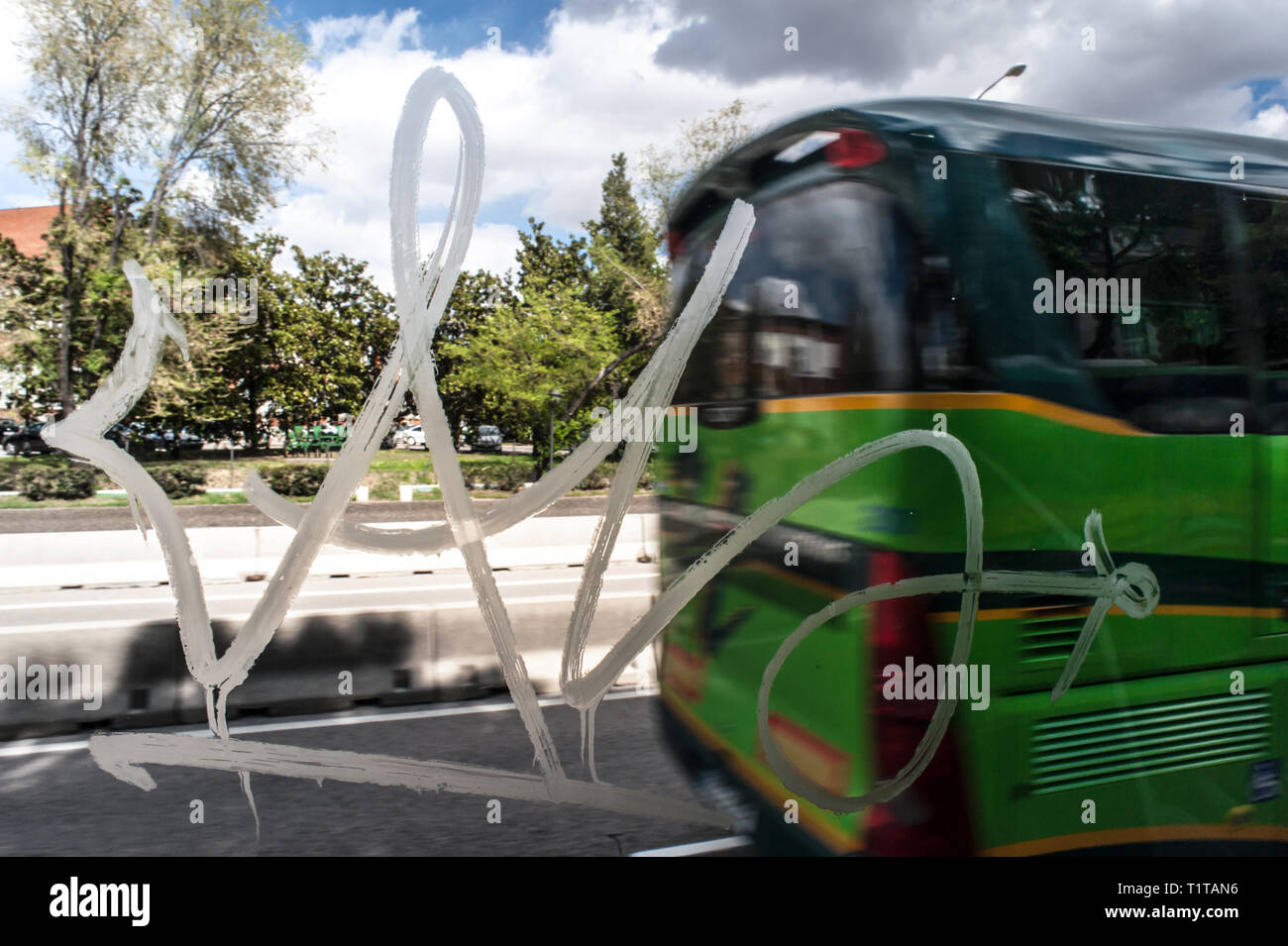 Graffiti tag on a bus window, Madrid, Spain Stock Photo - Alamy