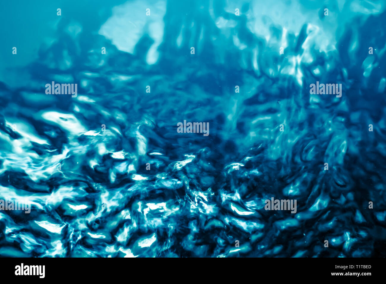 Abstract blue liquid surface as background - futuristic design and ...
