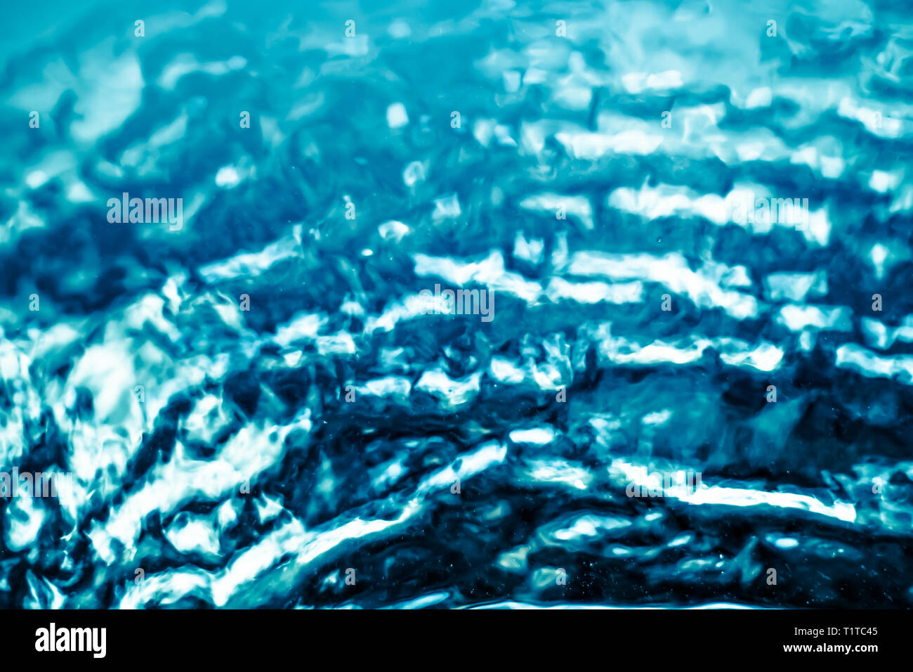 Abstract blue liquid surface as background - futuristic design and ...