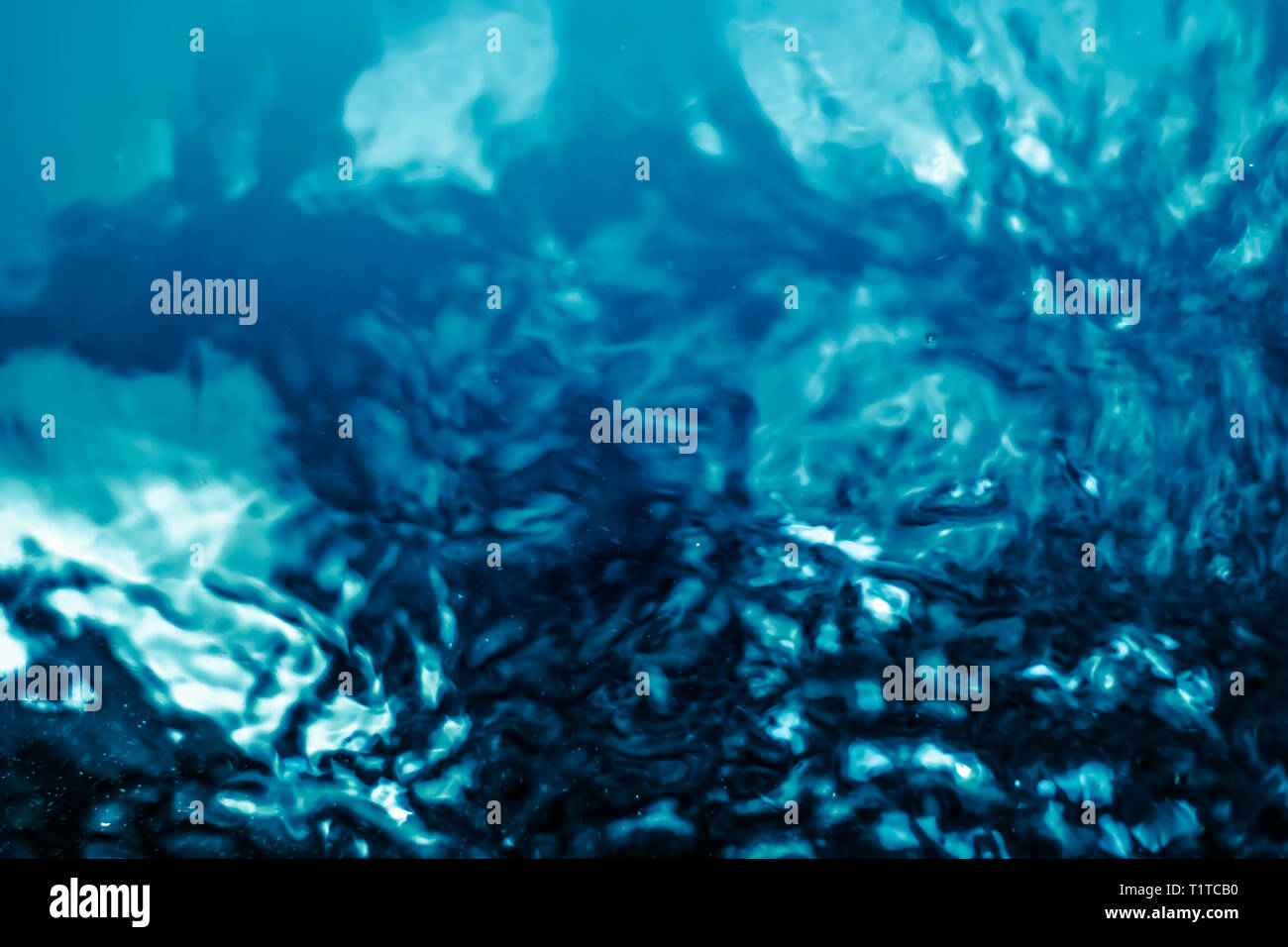 Abstract blue liquid surface as background - futuristic design and ...