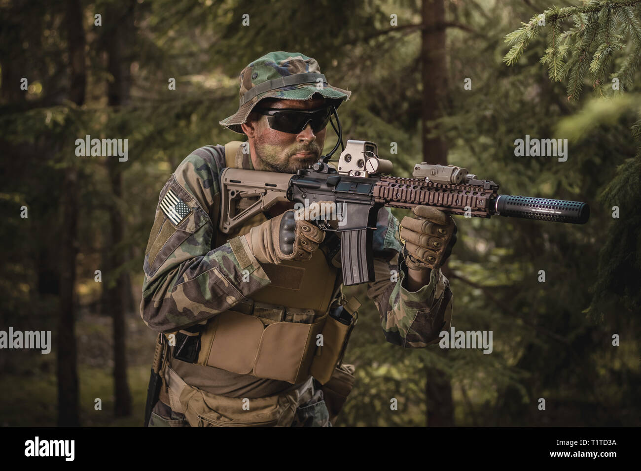 Special Forces soldier with an assault rifle in the forest Stock Photo ...