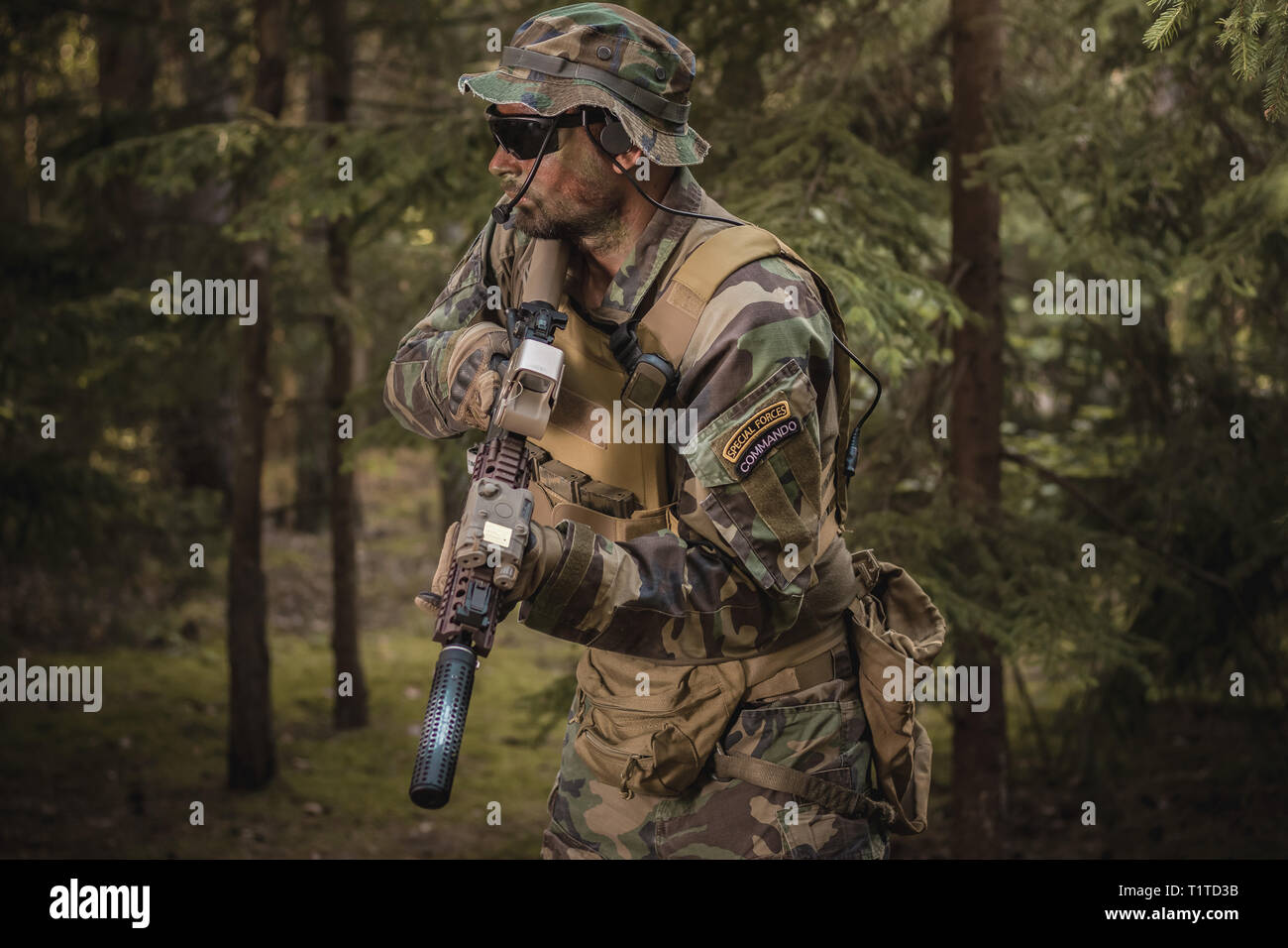 Special Forces soldier with an assault rifle in the forest Stock Photo ...