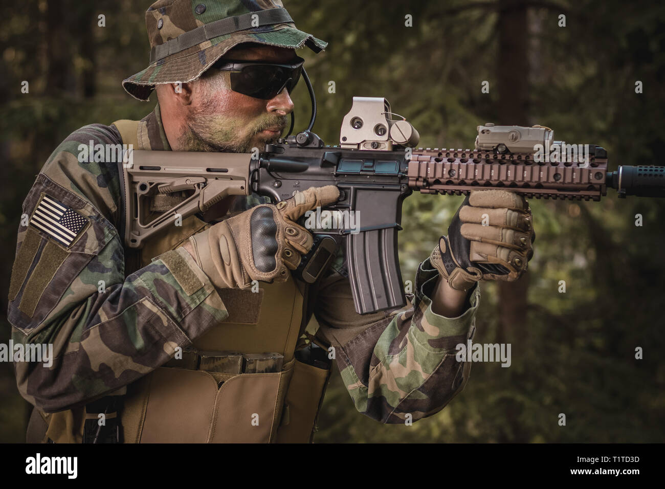 Special Forces soldier with an assault rifle in the forest Stock Photo ...