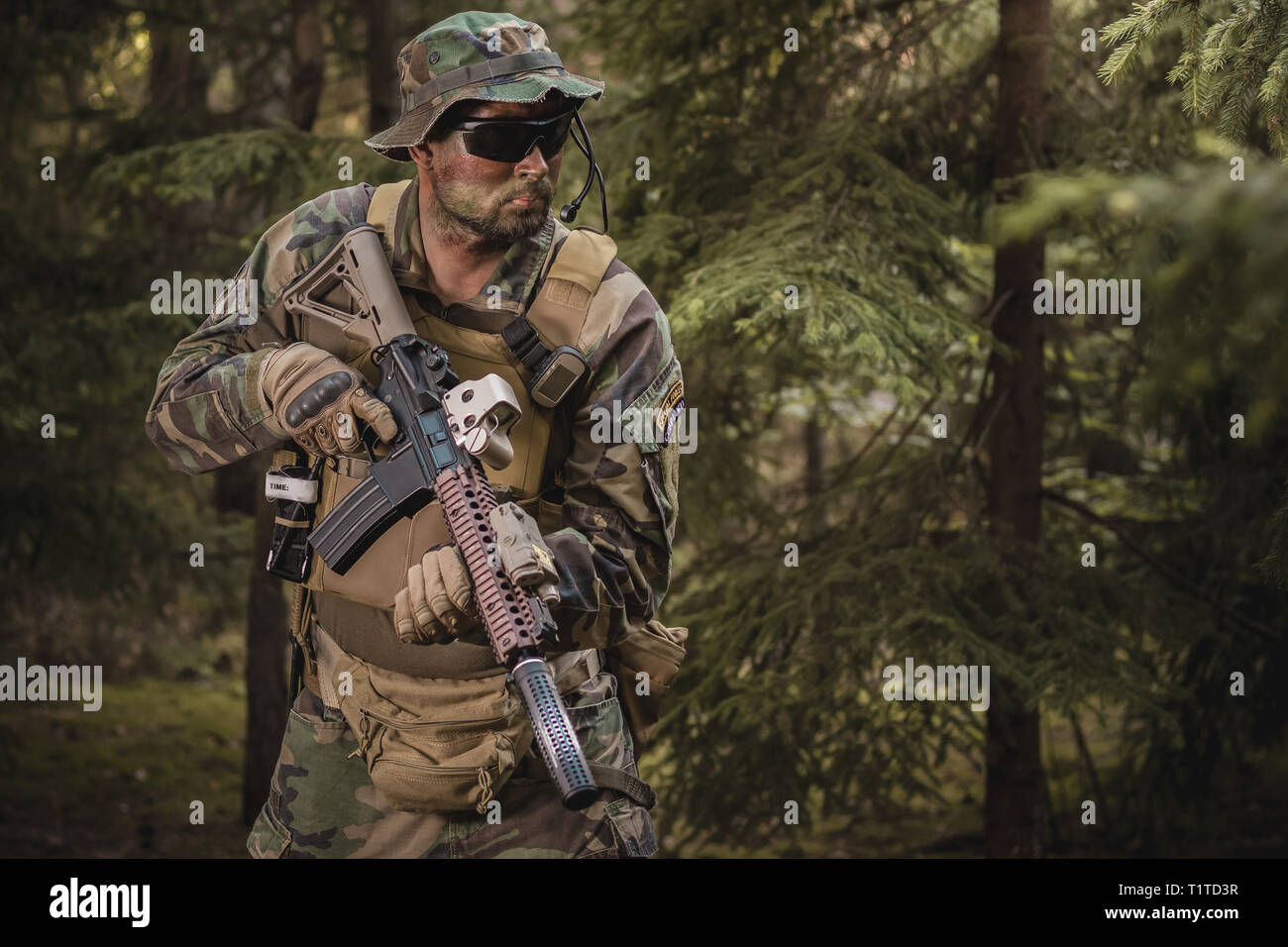 Special Forces soldier with an assault rifle in the forest Stock Photo ...