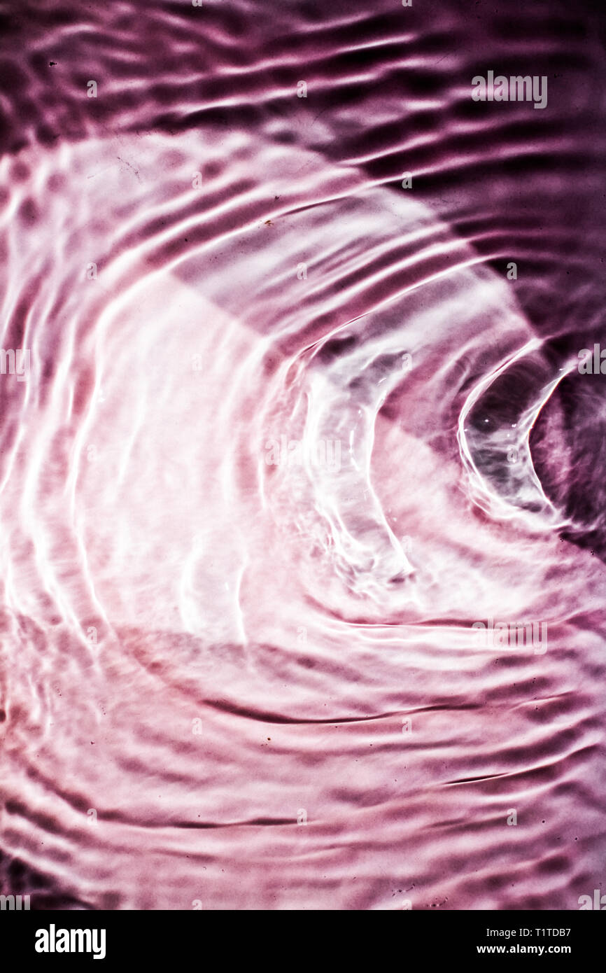 Pink flowing water texture as an abstract background - colourful ...
